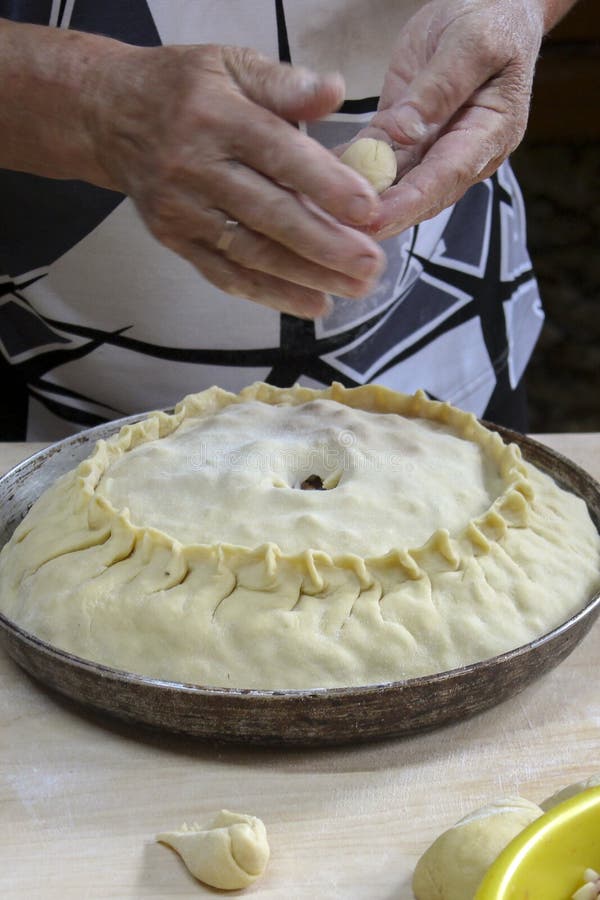 The Process of Decorating Closed Pie with Meat and Potato. Stock Image ...