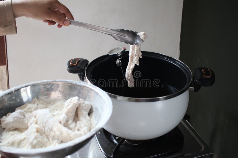 Process of Deep Frying Breaded Crispy Chicken in Hot Oil Stock Photo ...