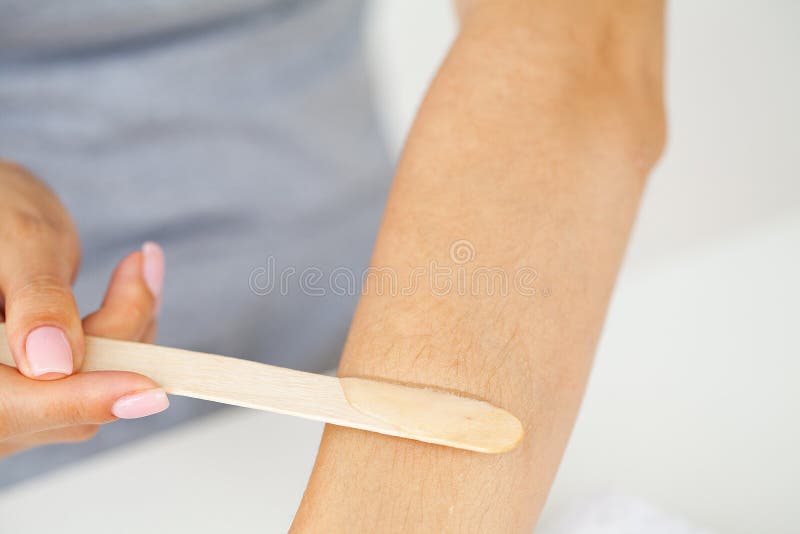 Process Depilation Female Hands in a Beauty Salon Stock Photo - Image ...