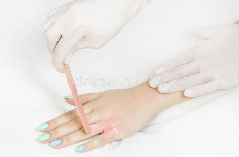 Closeup Depilation Process of Female Body Parts in Beauty Salon. Stock ...