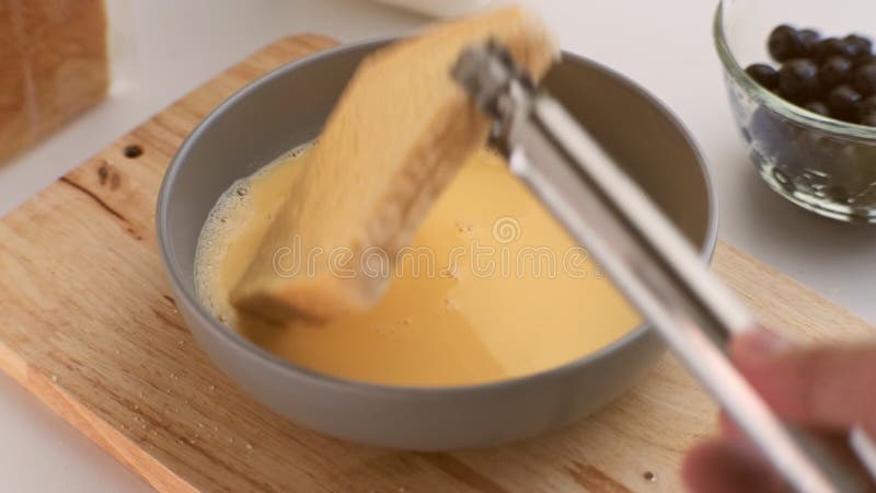 The Process of Dipping the Bread in the Egg To Fry in the Pan. Fried ...