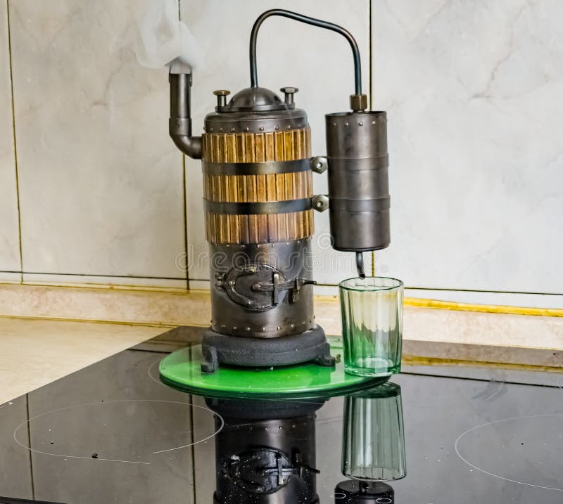 The Process of Distilling Wine at a Mini Distillery Using Wood. Volume ...