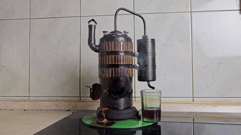 The Process of Distilling Wine at a Mini Distillery Using Wood. Volume ...