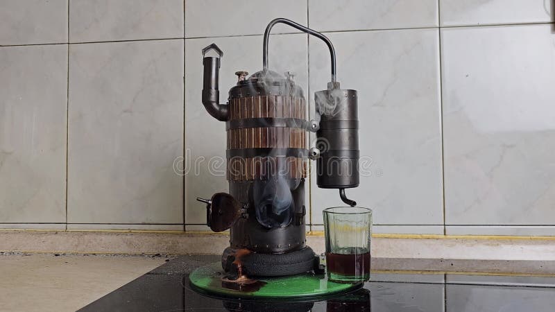 The Process of Distilling Wine at a Mini Distillery Using Wood. Volume ...