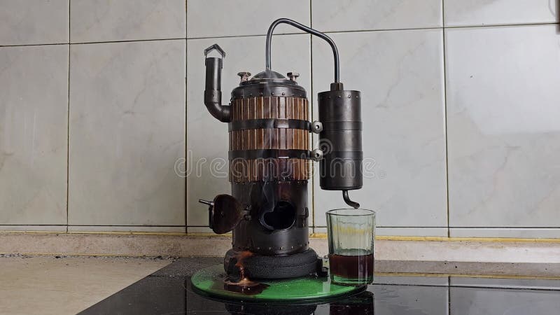 The Process of Distilling Wine at a Mini Distillery Using Wood. Volume ...