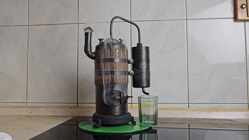 The Process of Distilling Wine at a Mini Distillery Using Wood. Volume ...