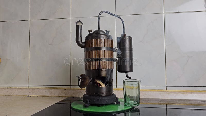The Process of Distilling Wine at a Mini Distillery Using Wood. Volume ...