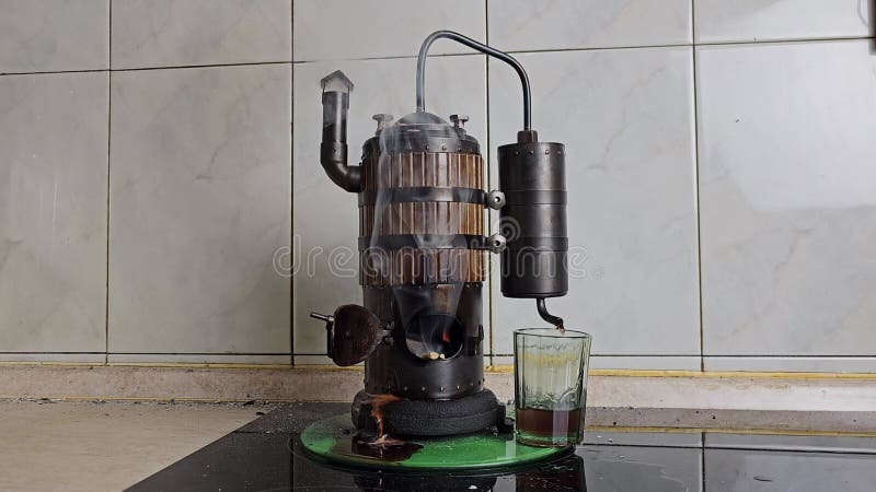 The Process of Distilling Wine at a Mini Distillery Using Wood. Volume ...