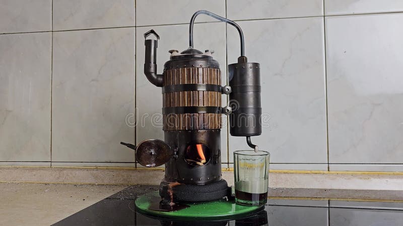 The Process of Distilling Wine at a Mini Distillery Using Wood. Volume ...