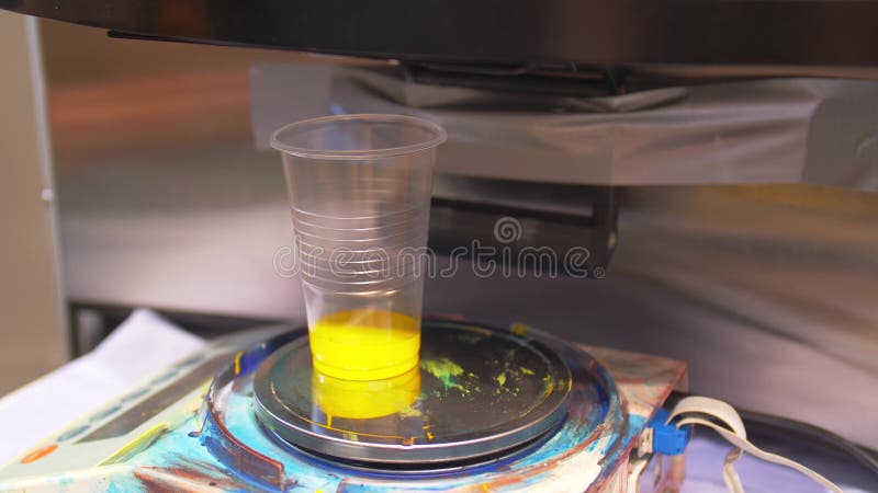 Process Dosing of Yellow Colorant in a Transparent Container. Stock ...