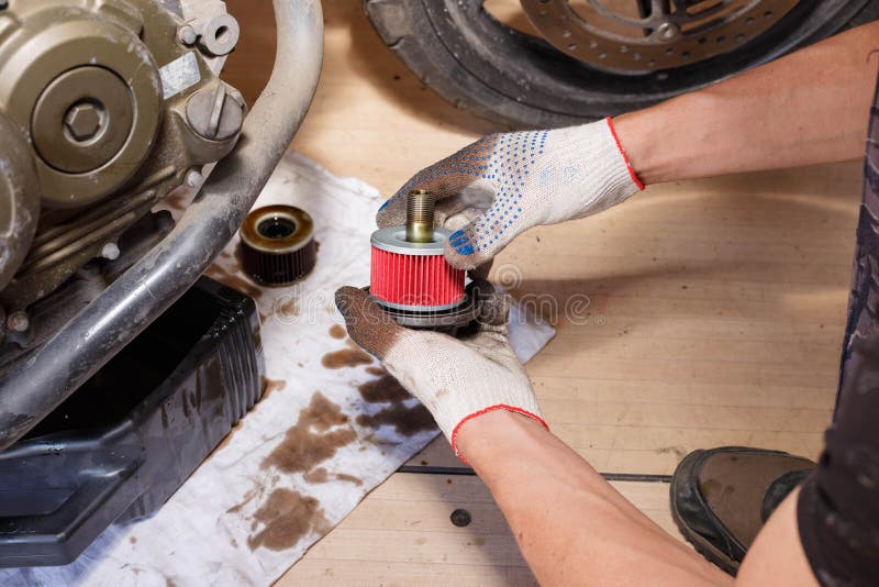 The Process of Draining Oil from a Motorcycle Engine. Engine Oil ...