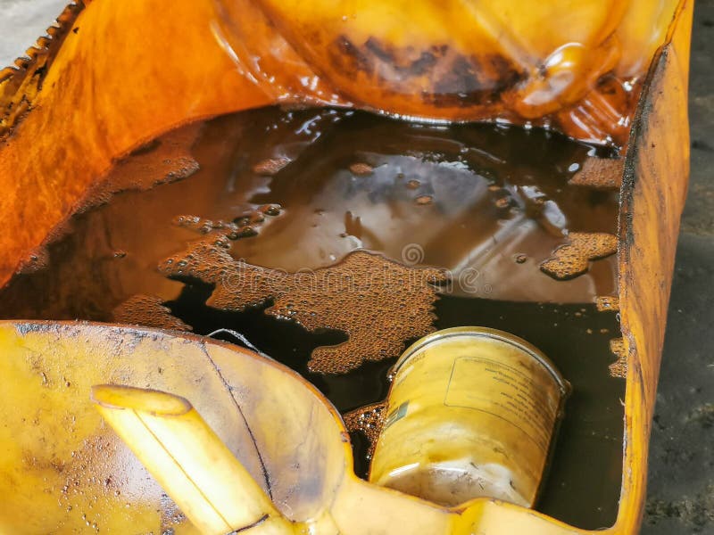 Process of Draining Old Dark Used Engine Oil. Stock Image - Image of ...