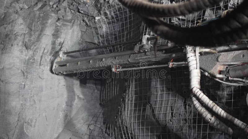 The Process of Drilling in an Underground Mine. Close-up Shows the ...