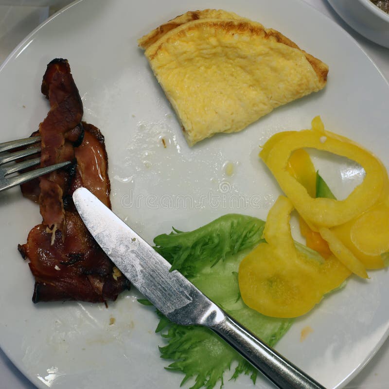 Process of Eating Breakfast Including Bacon, Eggs and Veggies Stock ...