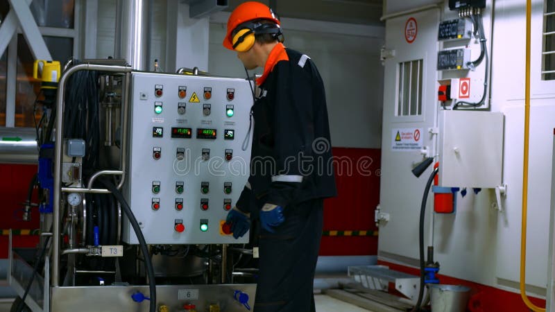 Process Engineer Monitors Equipment Indicators on Panel To Prevent ...