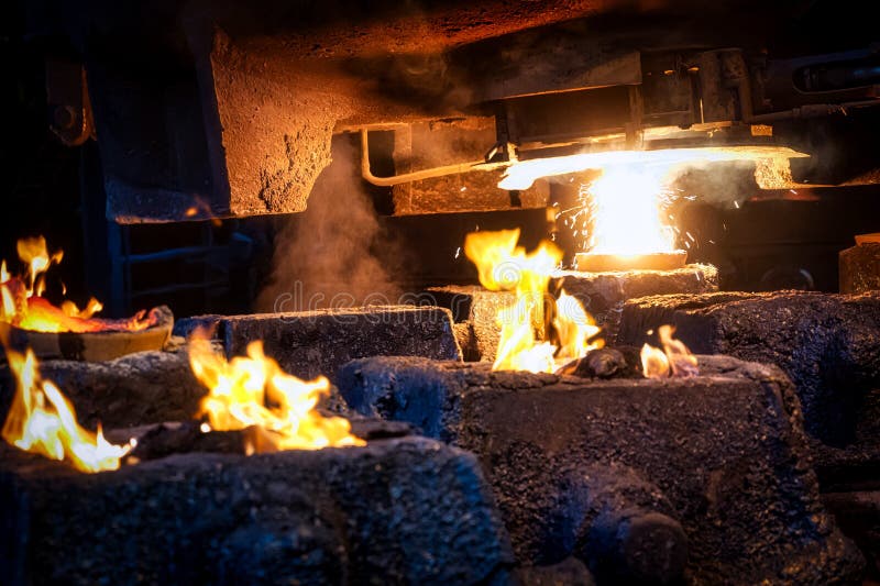The Process of Filling Liquid Metal with Steel Molds Stock Image ...
