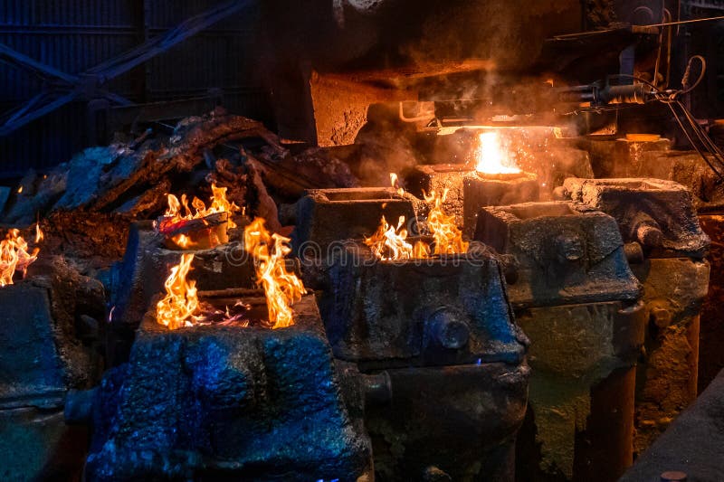 The Process of Filling Liquid Metal with Steel Molds Stock Photo ...