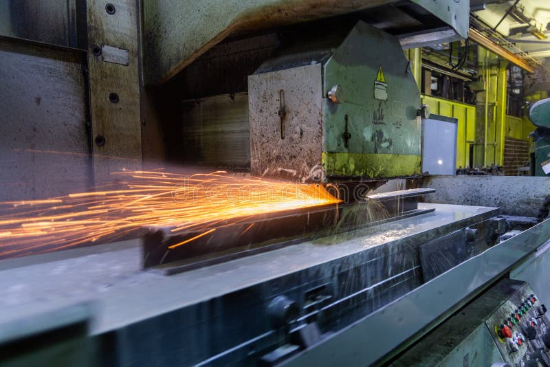 A Process of Flat Surface Grinding with a Lot of Sparks and Liquid ...