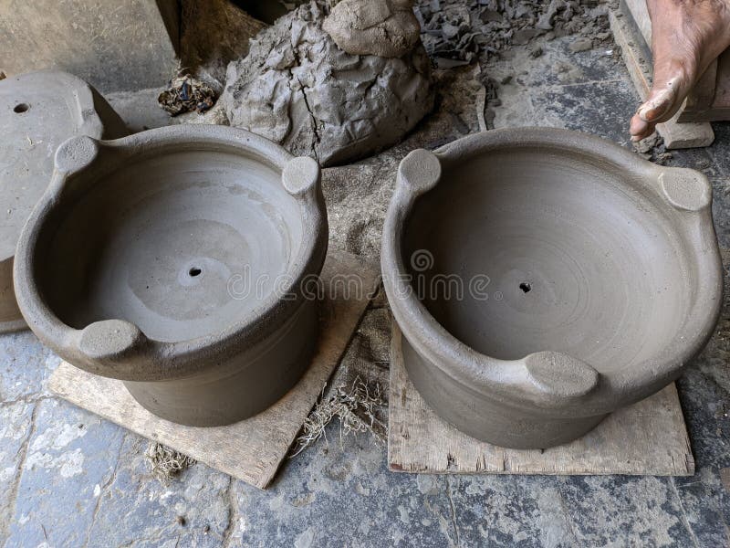The Process of Forming a Round Shaped Pottery Base for Cooking Made of ...