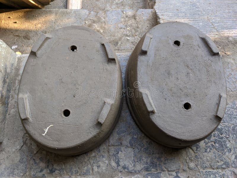 The Process of Forming a Round Shaped Pottery Base for Cooking Made of ...