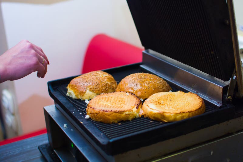 The Process of Frying Buns on an Electric Grill Stock Image - Image of ...