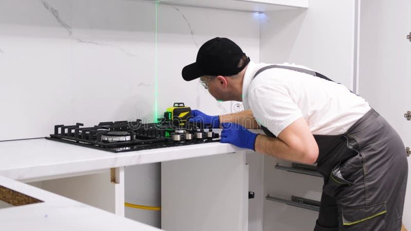 The Process of Installing Furniture in the Kitchen Using a Construction ...