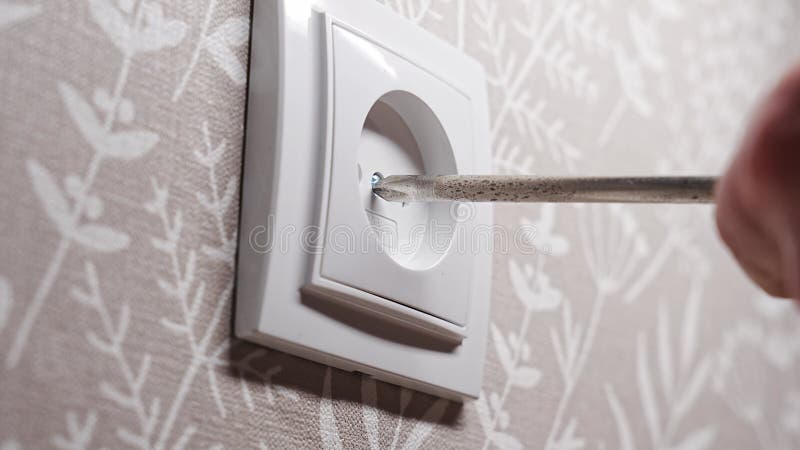 Installing a New Electrical Outlet with a Screwdriver at Home Stock ...