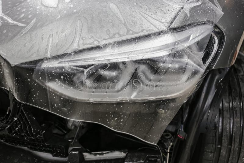 The Process of Installing PPF on the Hood of the Car. Anti-gravity ...