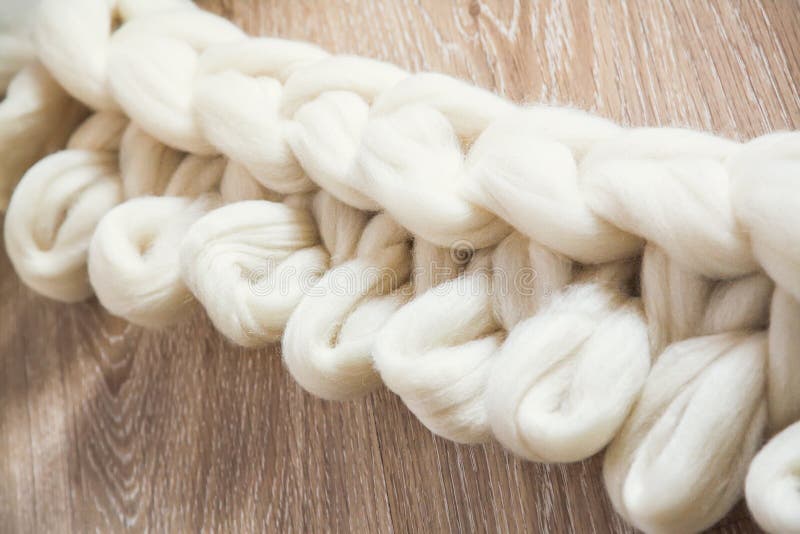 The Process of Knitting a Plaid of Large Knitting from Merino Wool ...