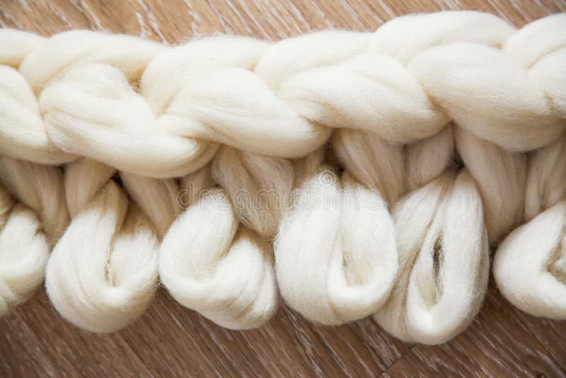 The Process of Knitting a Plaid of Large Knitting from Merino Wool ...