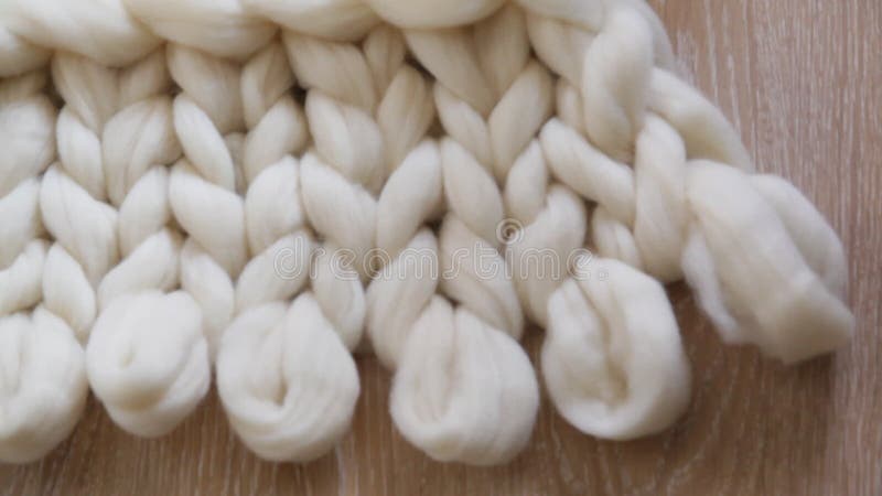 The Process of Knitting a Plaid of Large Knitting from Merino Wool ...