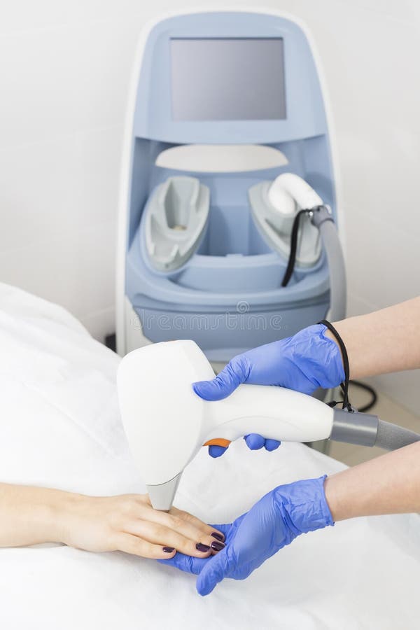 The Process of Laser Depilation of Female Limbs Stock Photo - Image of ...