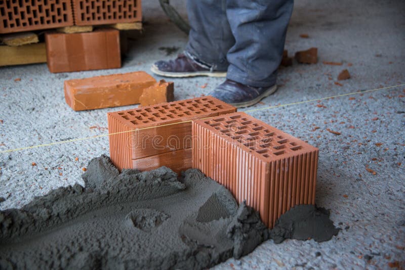 The Process of Laying Bricks on Construction Site Stock Photo - Image ...