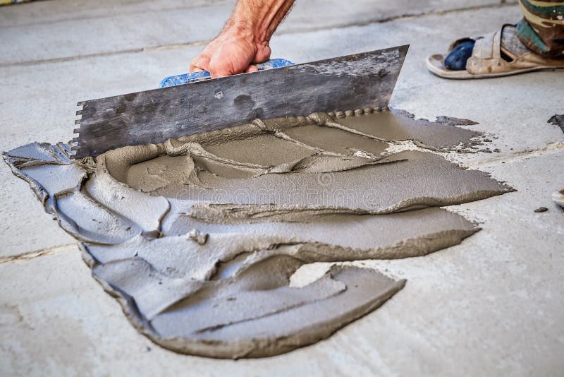 Laying floor ceramic tile stock image. Image of manual - 112213737