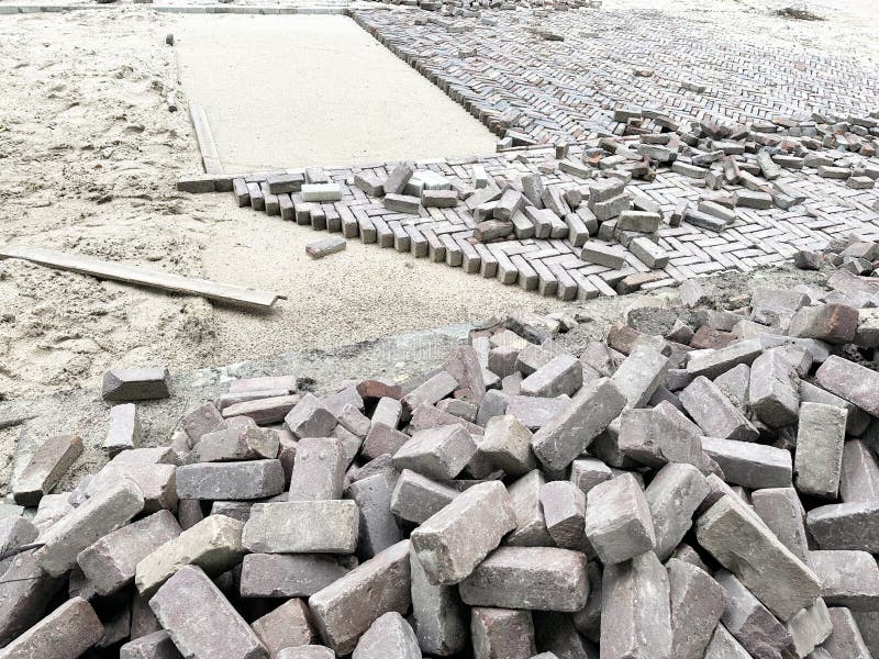 The Process of Laying Blocks on a Stone Pavement. Cadiz Stock Photo ...
