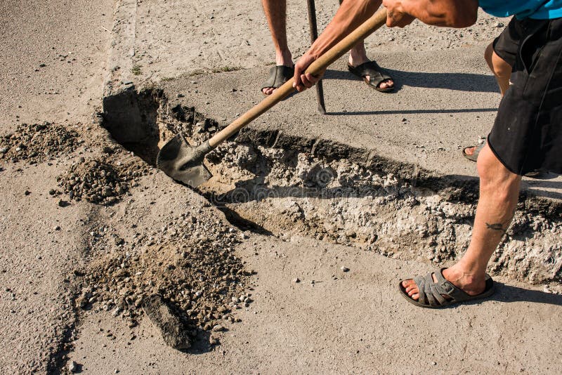 The Process of Laying the Sidewalk Curb. Workers Prepare a Trench for ...