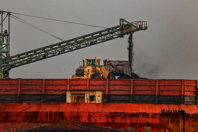 The Process of Loading Coal Mining Products Onto Barges for Shipment ...
