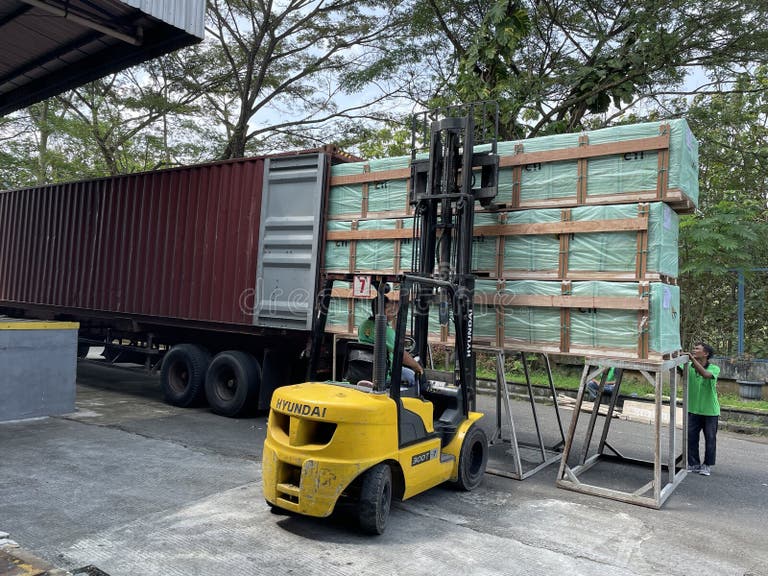 The Process of Loading Goods into Containers. Editorial Photo - Image ...