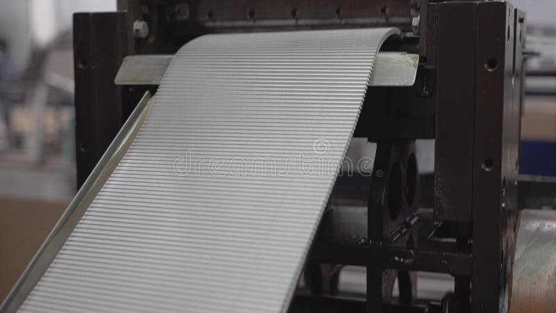 The Process of the Machine for Crimping Metal Sheets. the Camera is in ...