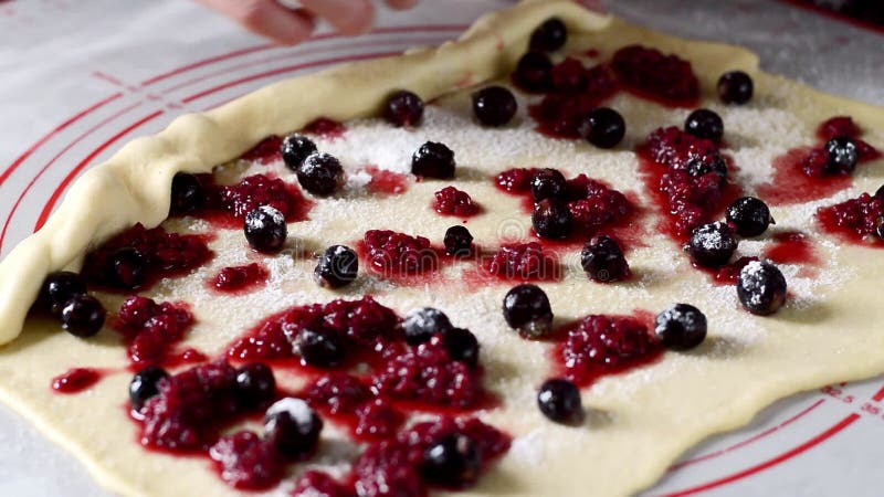 The Process of Making a Berry Roll. Stock Footage - Video of making ...