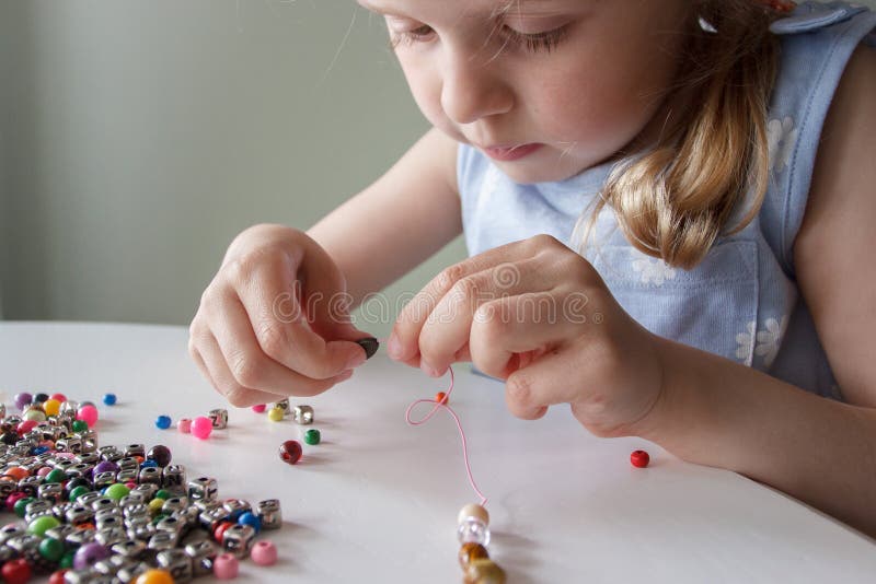 Process of Making a Bracelet from a Thread and Colored Beads, Concept ...