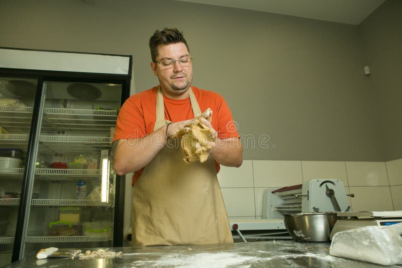 The Process of Making Bread. the Chef Kneads the Dough by Hand Stock ...