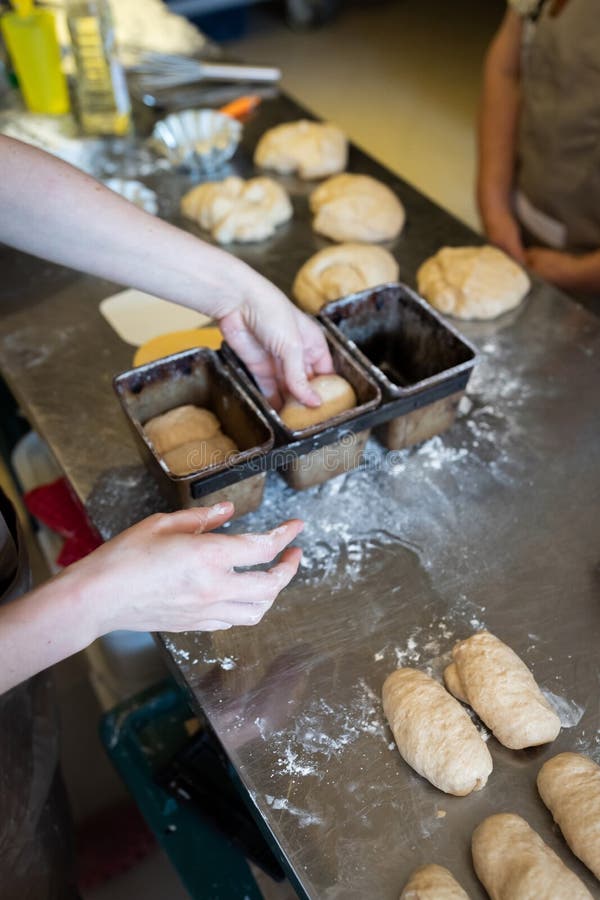 The Process of Making Brioche in an Artisan Bakery. Laying the Dough in ...
