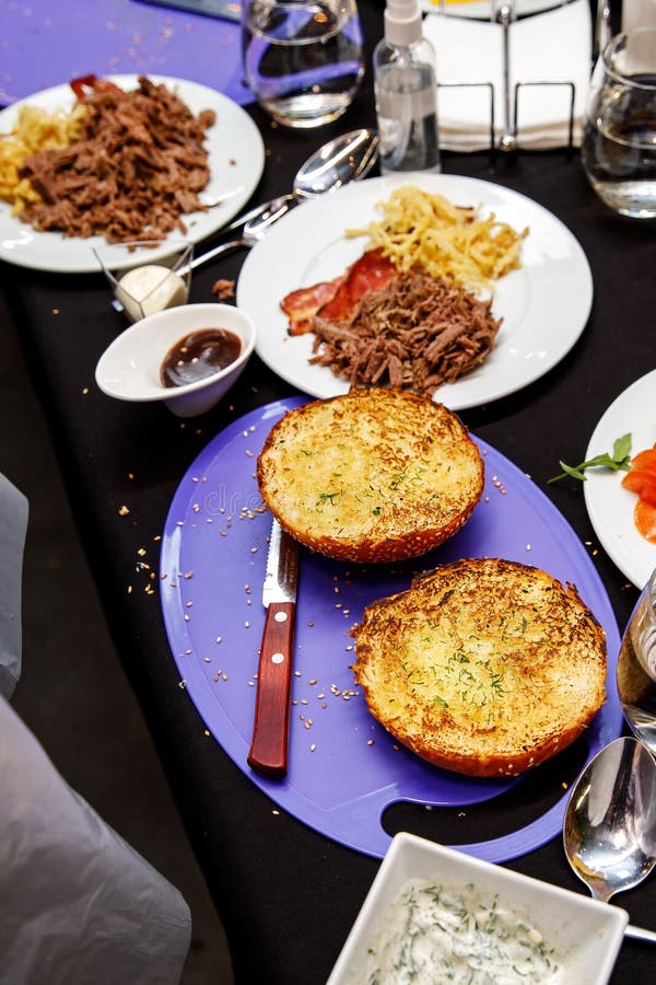 The Process of Making a Burger in a Restaurant Kitchen. Close-up of ...