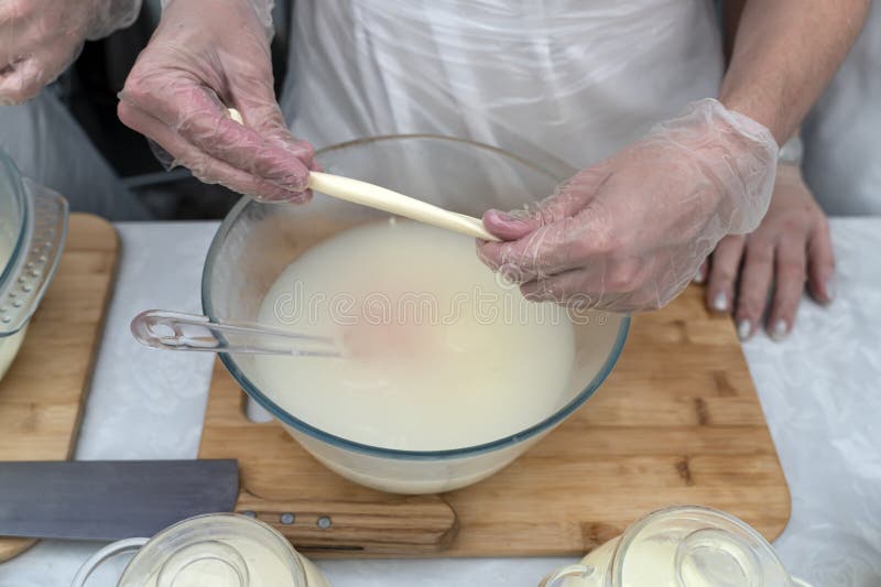 Process of Making Cheese with a Pigtail. Hands Kneading Cheese in Milk ...