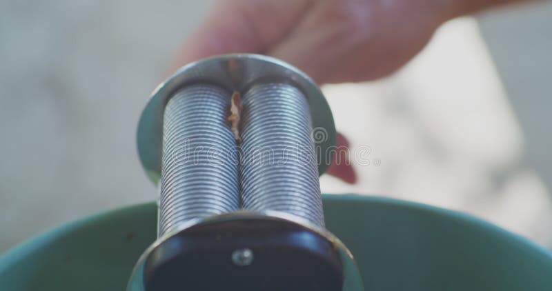 The Process of Making Cigarettes. Grinding Dry Tobacco with a Special ...