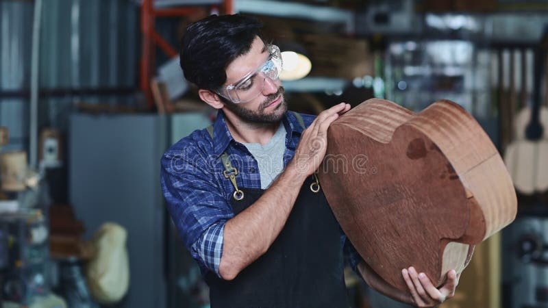 The Process of Making a Classical Guitar, Luthier Checking Guitar Stock ...