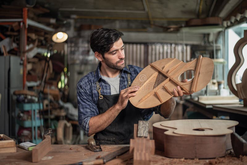 Luthier Creating a Guitar and Using Tools in a Traditional Stock Photo ...
