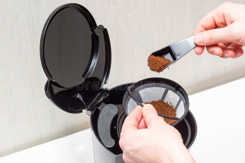 Process of Making Coffee from Ground Beans in a Coffee Maker - Loading ...