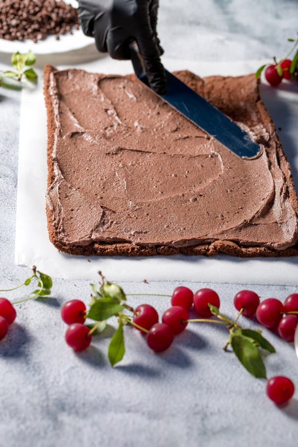 The Process of Making Cooking Roll in Kitchen with Cherries and Grated ...